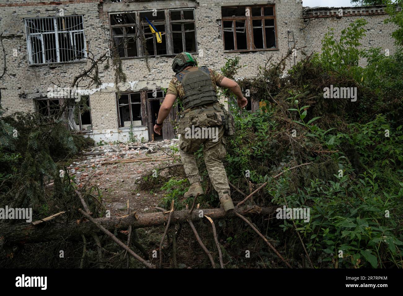 A Ukrainian serviceman of the 68th Oleksa Dovbush hunting brigade runs ...