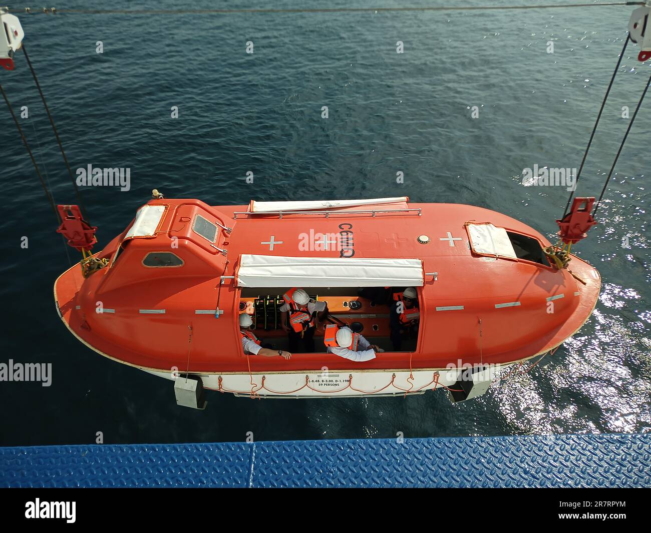 lounging life boat from a ship with crew,life boat lounging,,safety ...
