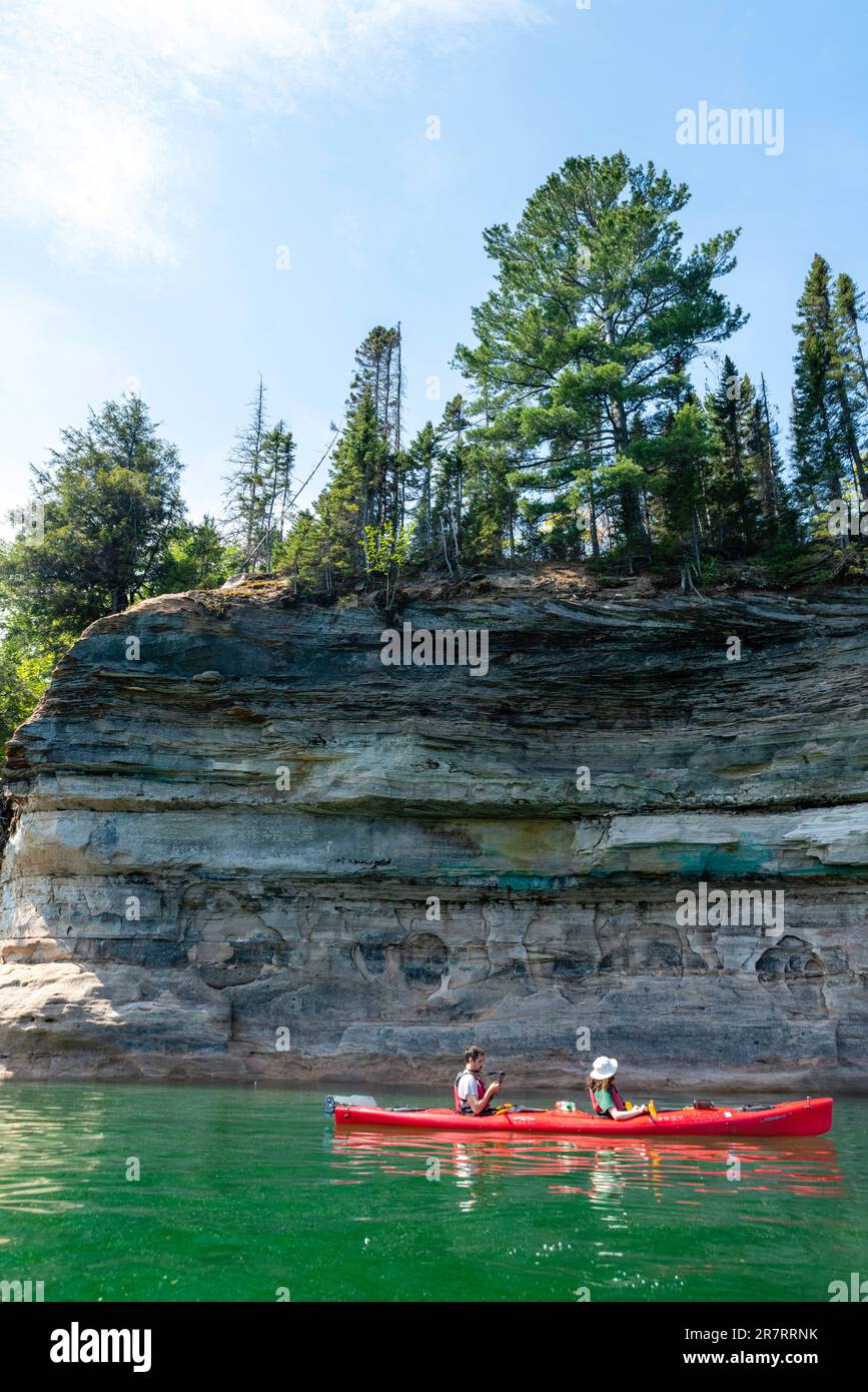 Photograph of sandstone cliffs leaching copper oxides while exploring ...