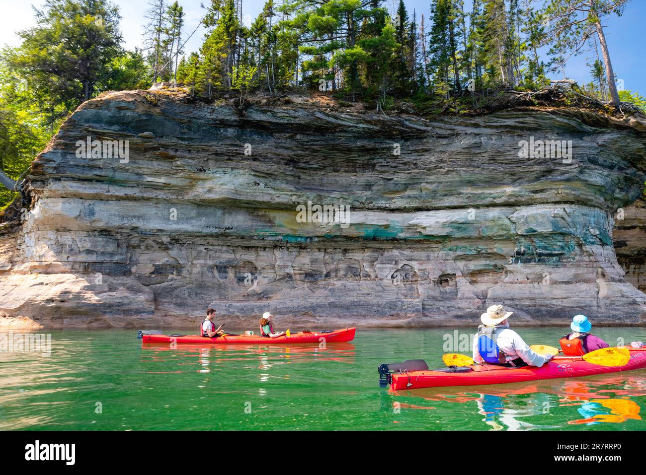 Photograph of sandstone cliffs leaching copper oxides while exploring ...