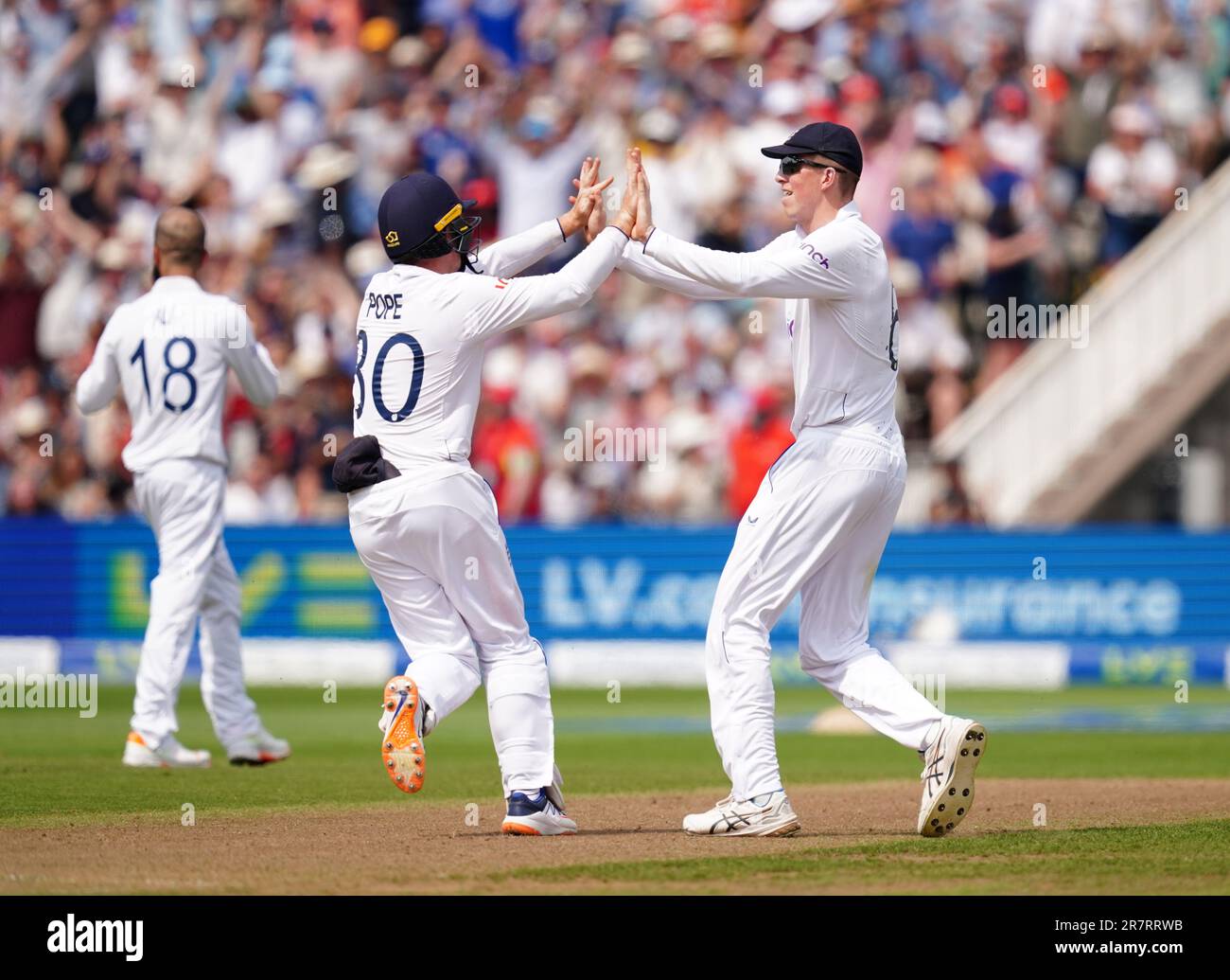 England's Zak Crawley (right) celebrates catching out Australia's ...