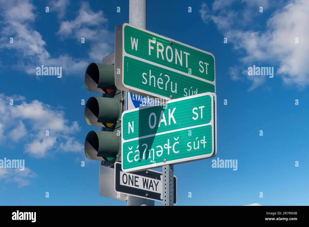 Low angle view of bilingual (English and Klallam) street signs on the ...