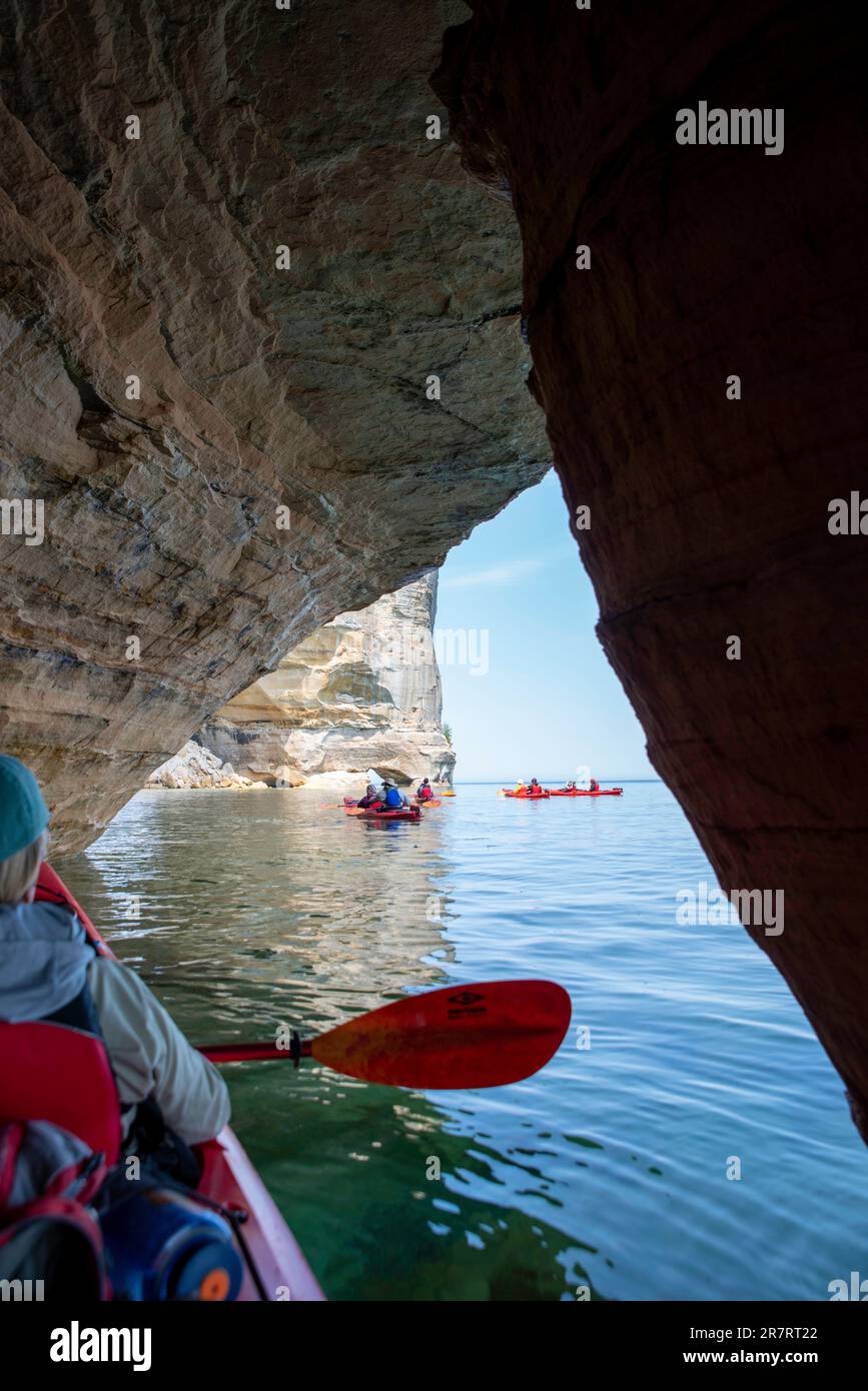Negotiating Limbo Cave. Exploring with a kayak, Pictured Rocks National ...