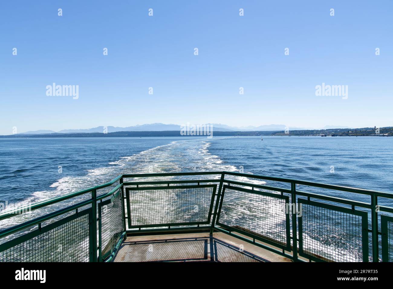 View from deck with railing at the stern of a ferry within the Port ...