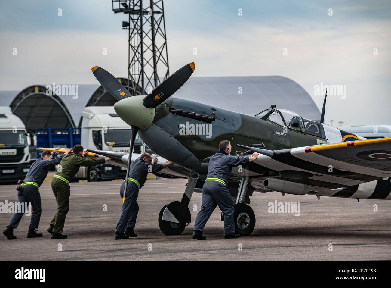 Ground crew prepare a Spitfire as the Battle of Britain memorial flight ...