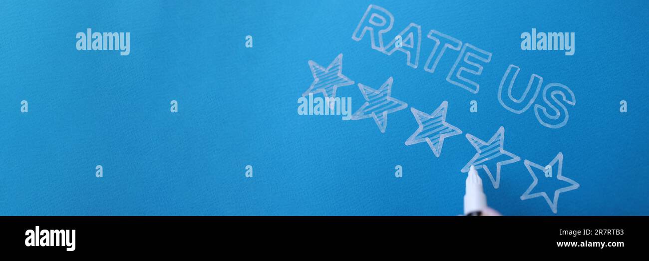 Handwritten review rate us and star rating on blue background Stock ...