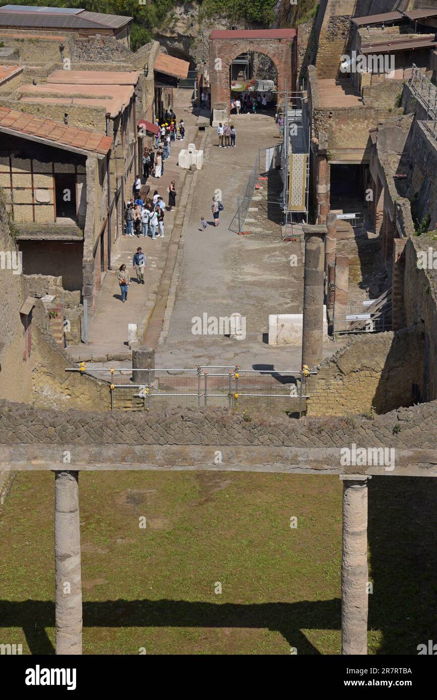Tourists viewing the preserved Roman town of Herculaneumm buried in the ...