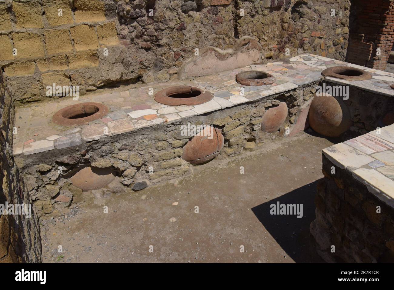 Remains of Dolium storage jars in Roman shop counters in the town of ...