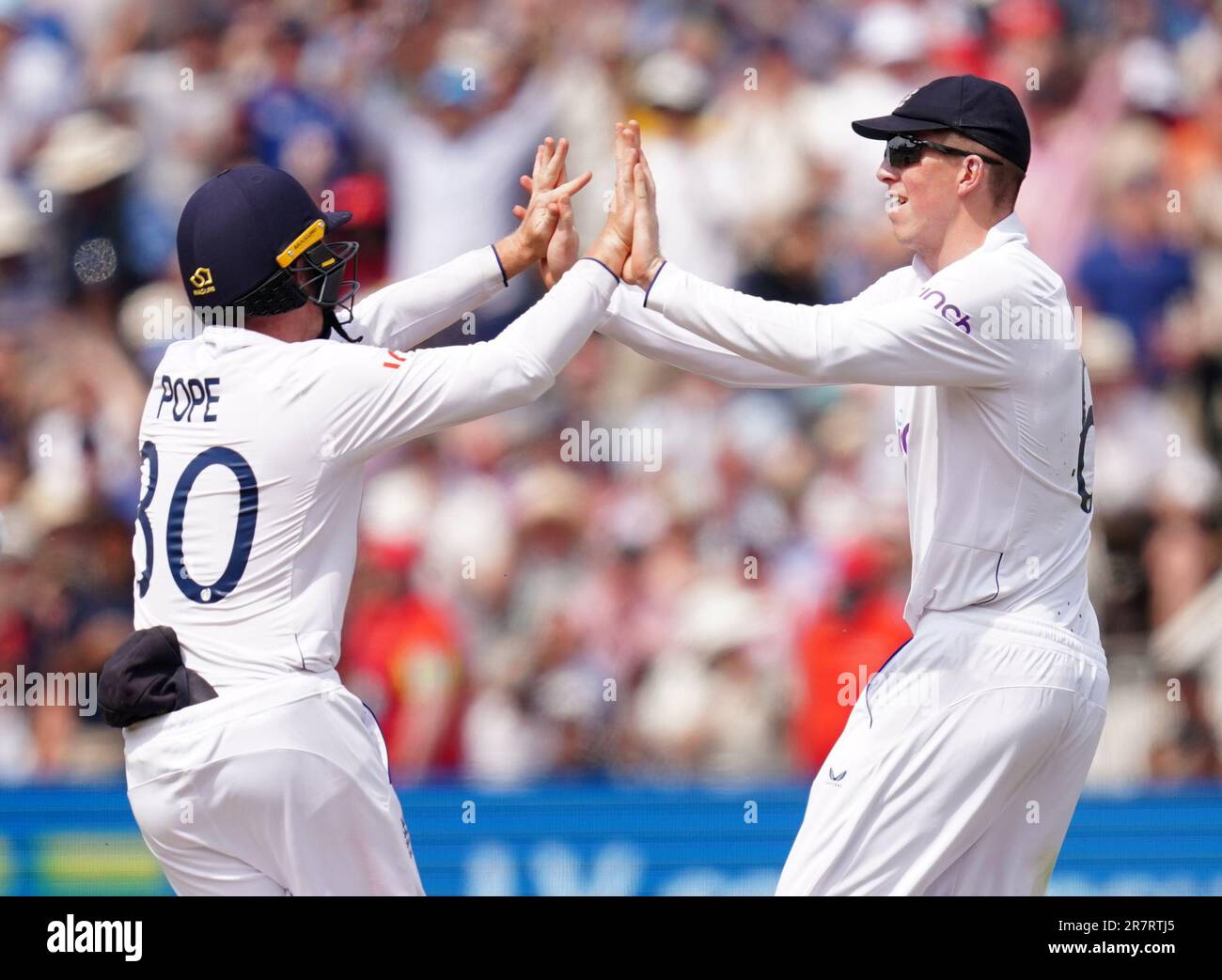 England's Zak Crawley (right) celebrates catching out Australia's ...