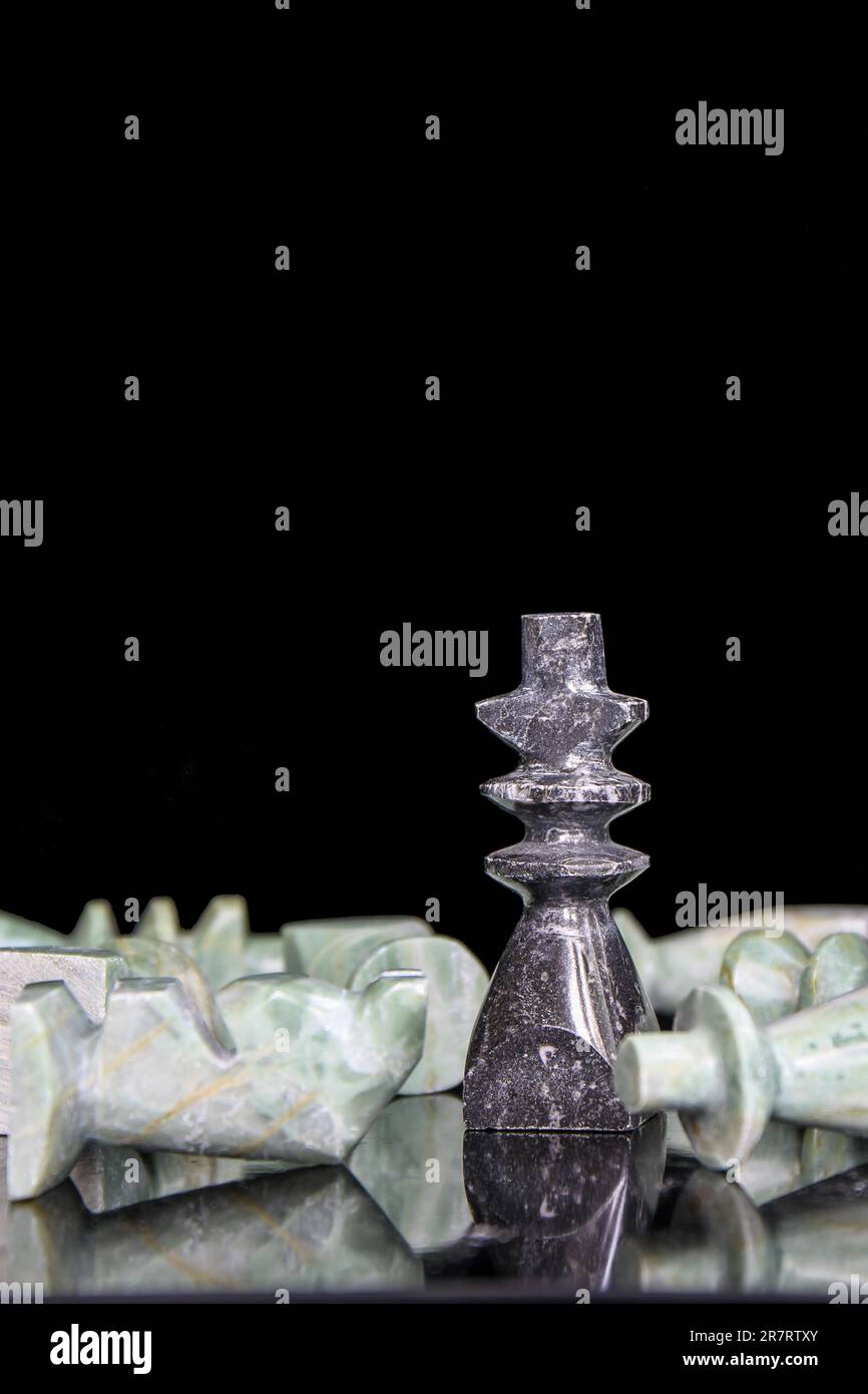 King defeats all other in chess game, symbol of victory with marble ...