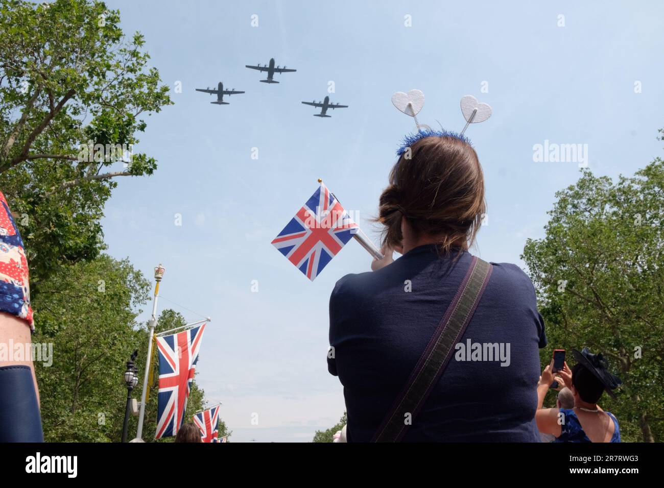 London, UK. 17th June, 2023. Royal fans watch a flypast of 70 aircraft ... London, UK. 17th June, 2023. Royal fans watch a flypast of 70 aircraft ...