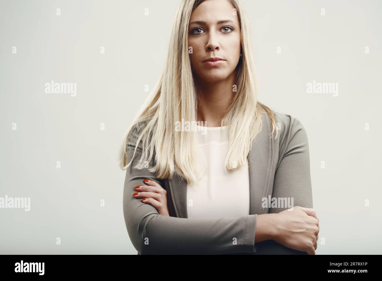 A young blonde, serious and introspective, symbolizes resilience and ...