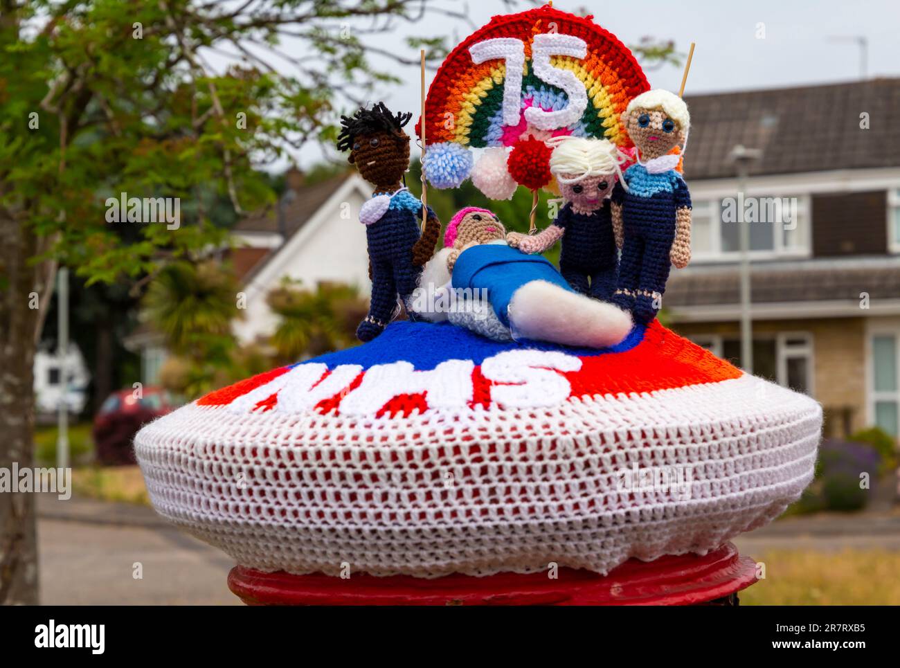 Poole, Dorset, UK. 17th June 2023. A knitted crocheted postbox topper ...