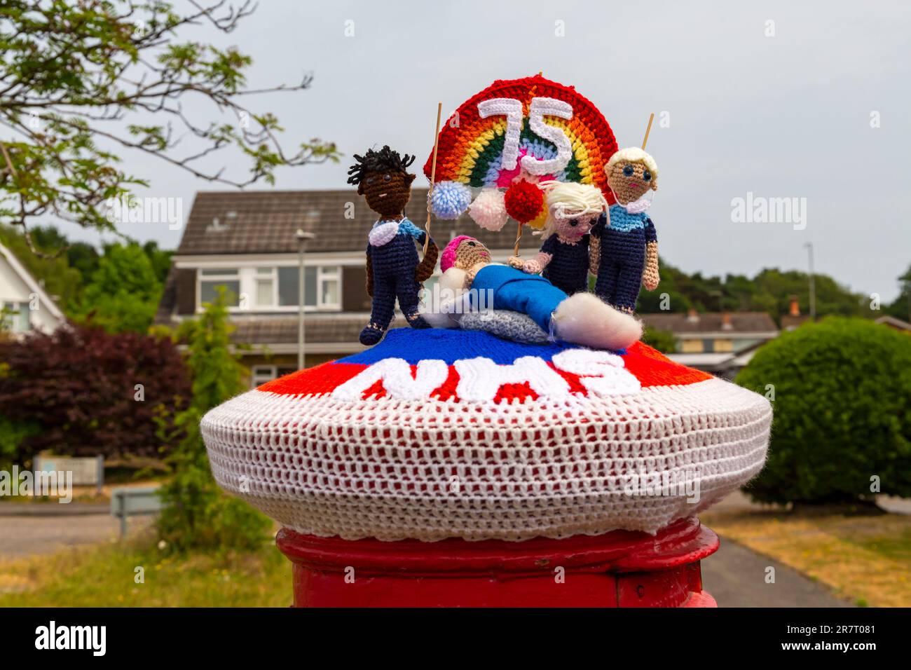 Poole, Dorset, UK. 17th June 2023. A knitted crocheted postbox topper ...