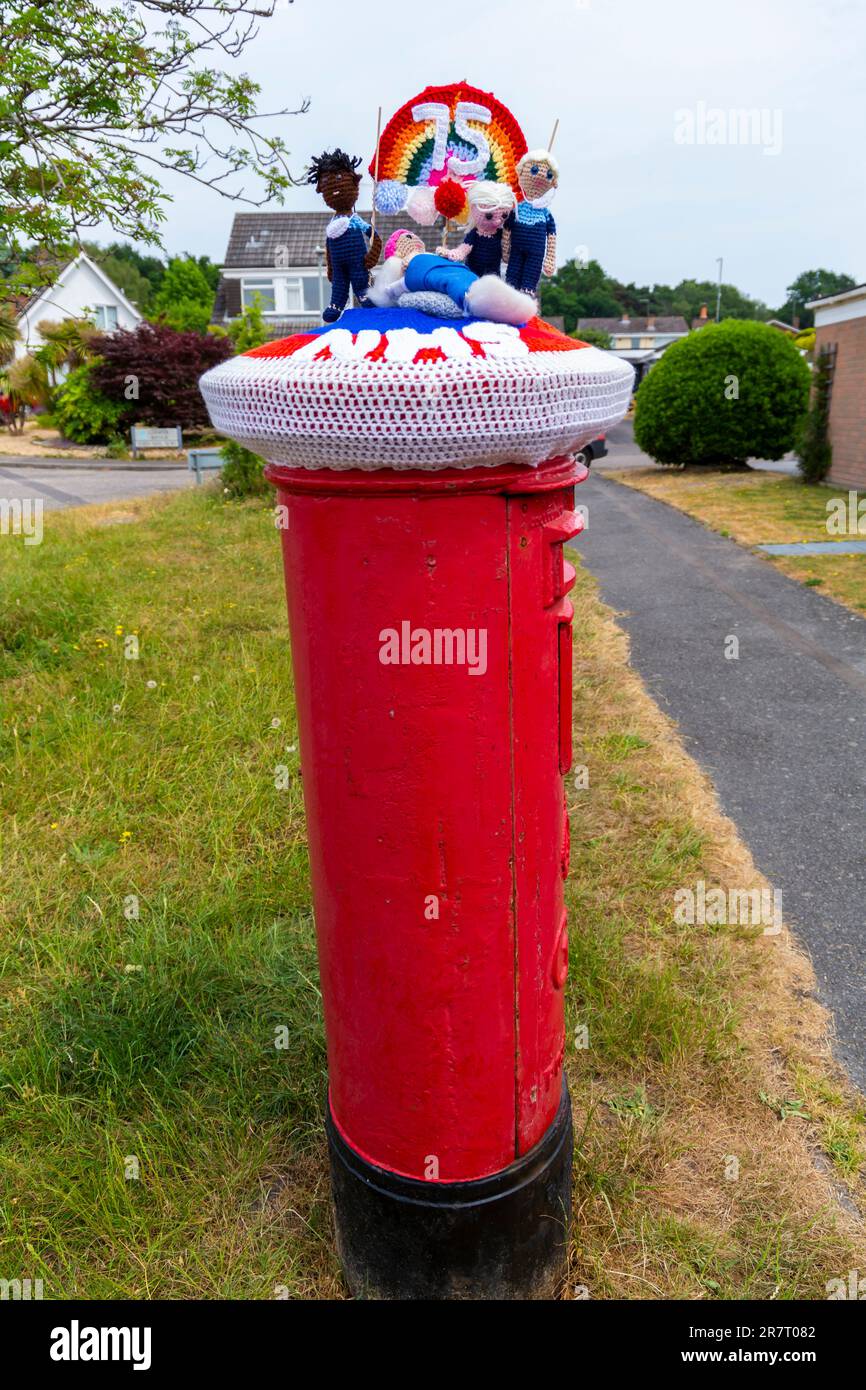 Poole, Dorset, UK. 17th June 2023. A knitted crocheted postbox topper ...