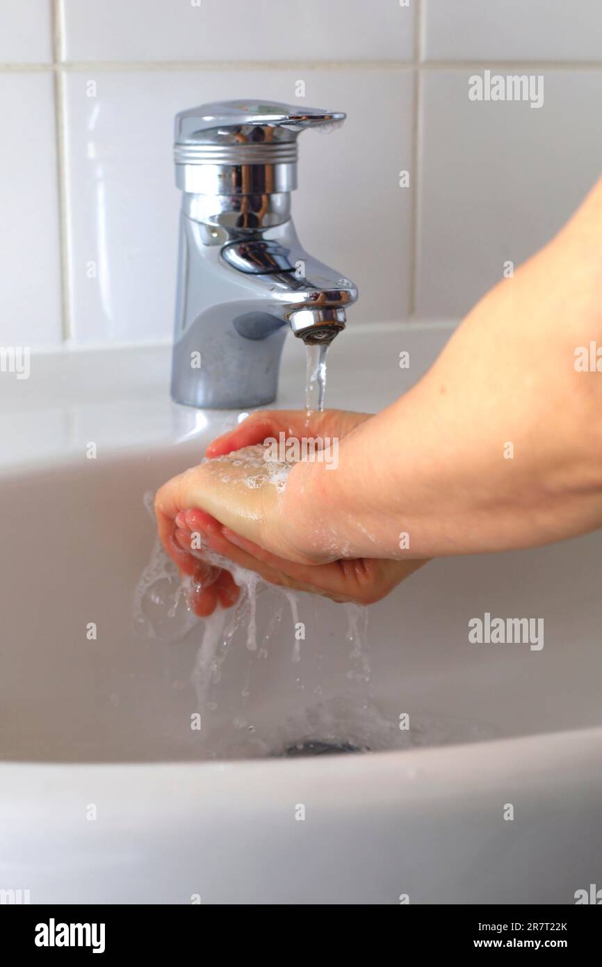 Old hands washing hi-res stock photography and images - Alamy