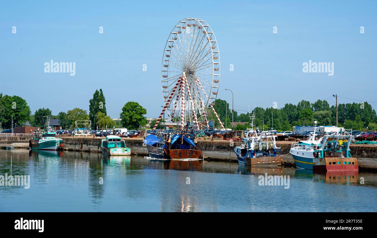 fishing boats and giant wheel at the harbour of the village Honfleur in ...