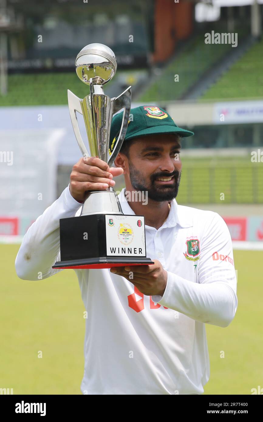 Litton Das holds the lone Test match trophy as Litton Das (2nd right ...