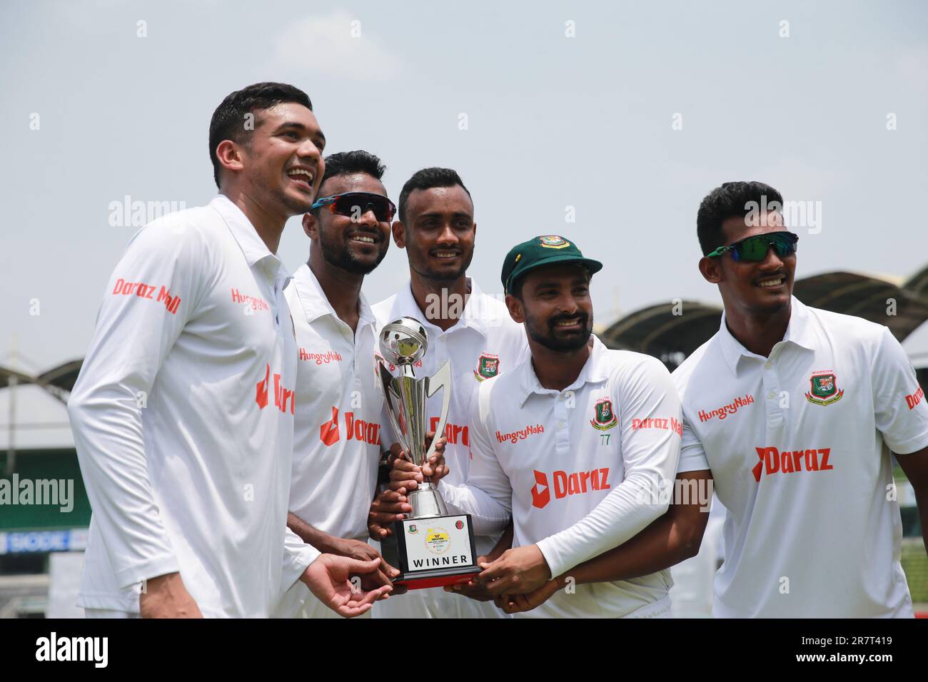 Litton Das (2nd right) holds the lone Test match trophy along the five ...