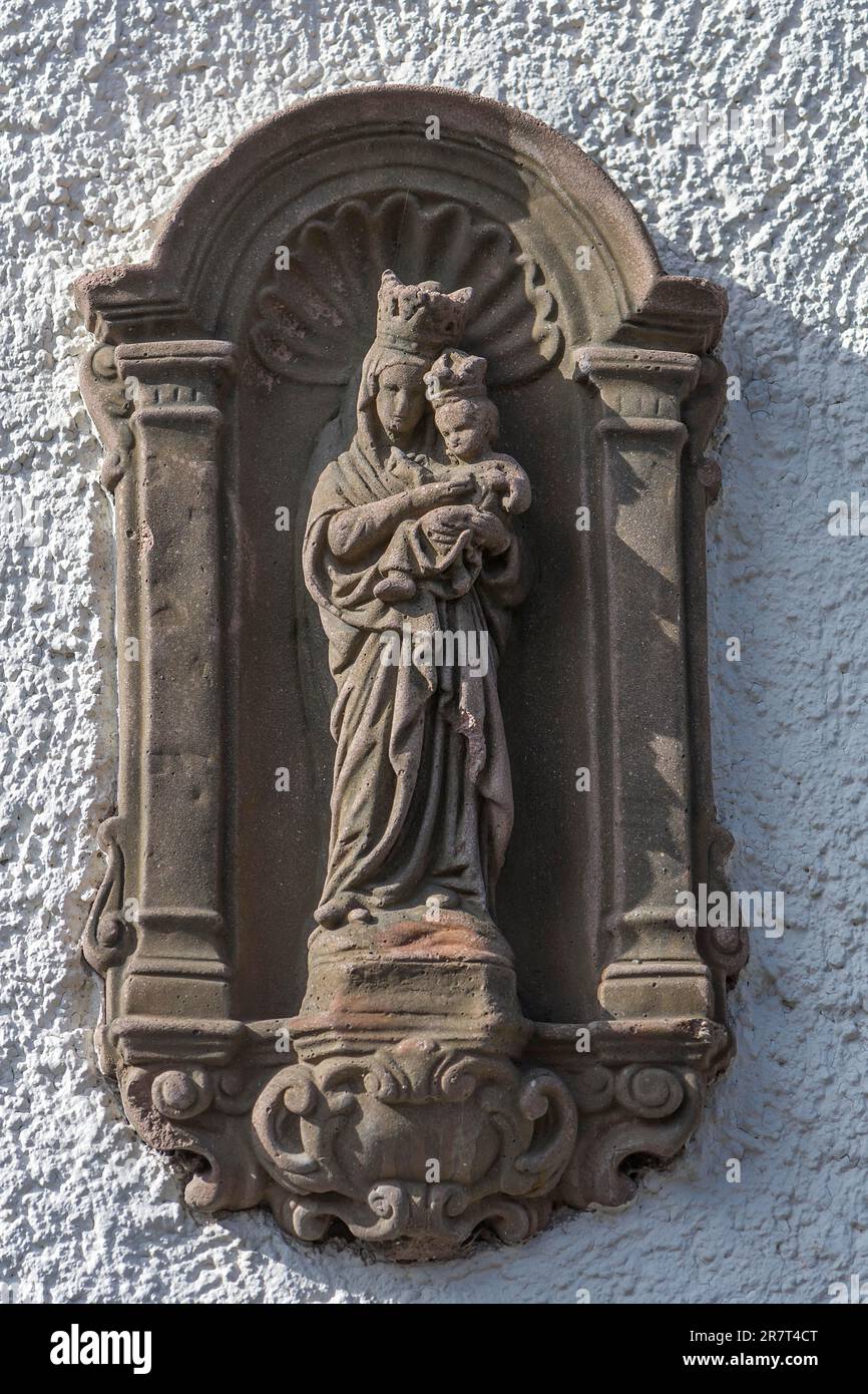 Religious sculpture of Mary with the Child Jesus on a house wall, Alken ...