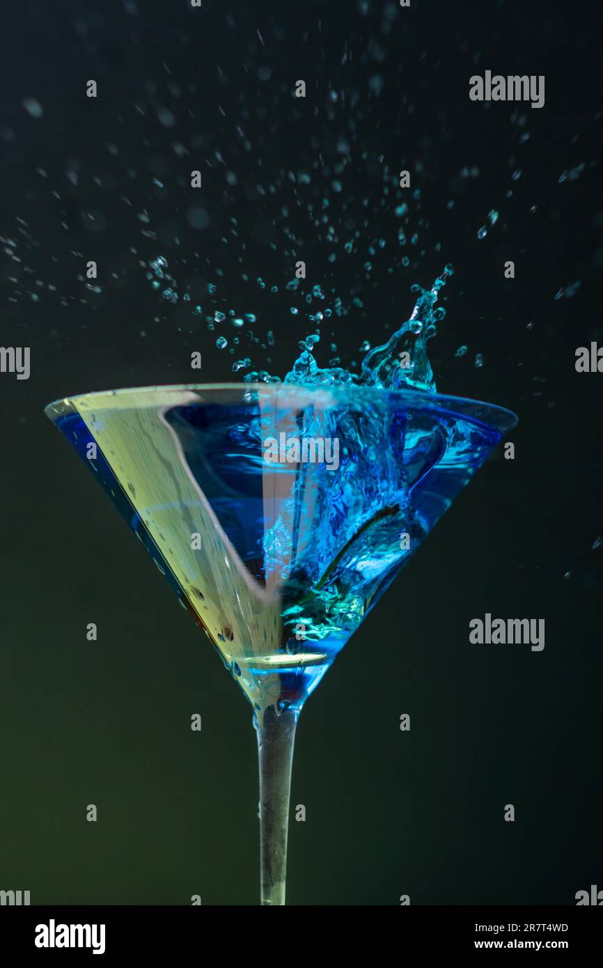 Cocktail glasses with different flavors and colors with splash effect ...