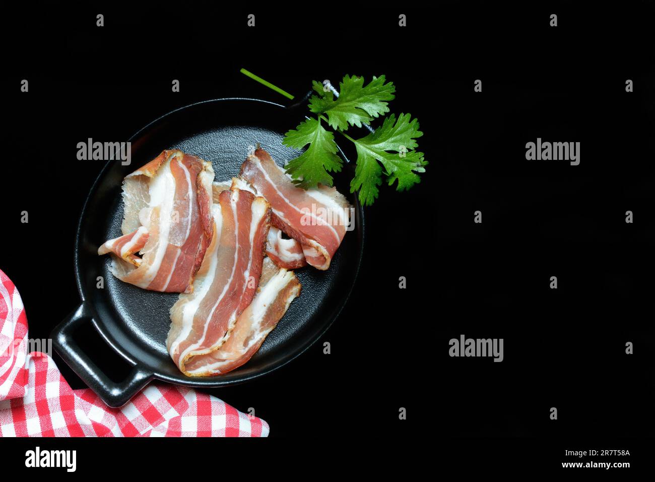 Bacon strips in pans Stock Photo - Alamy
