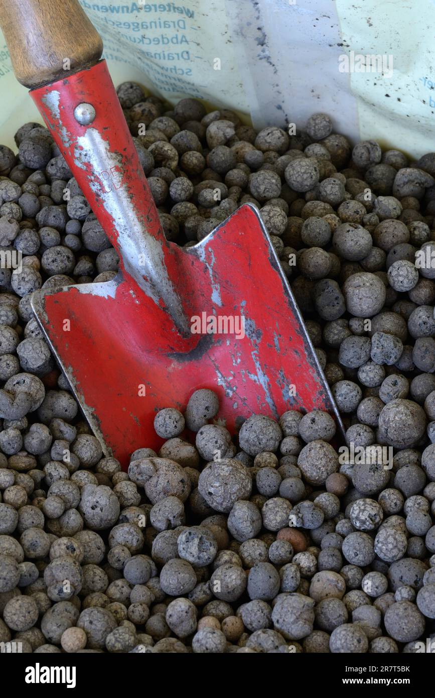 Expanded clay with shovel, drainage Stock Photo - Alamy