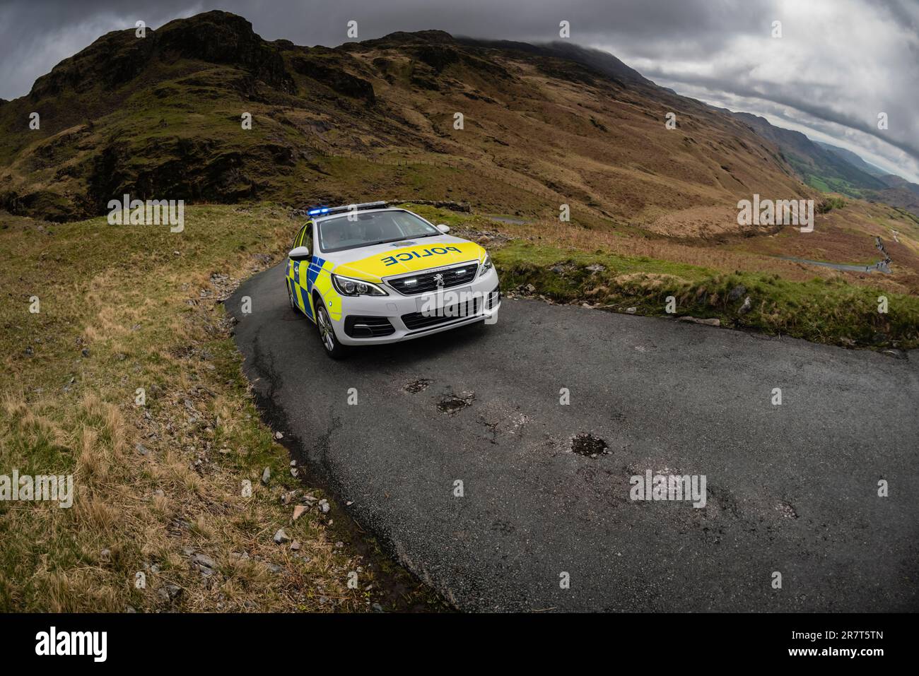 Police patrol car on Hardknott Pass, English Lake District, UK Stock ...