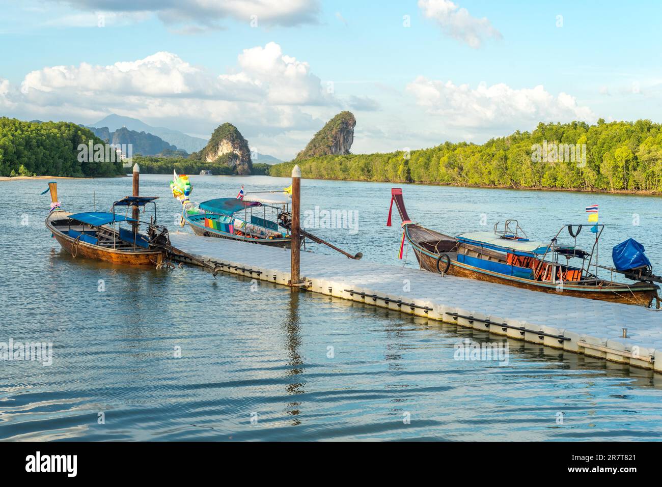 Long-tail boats at the pier on the Krabi river, a 5 kilometres long ...