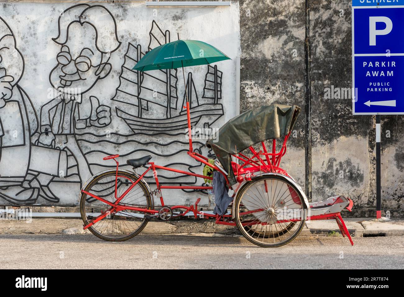 Parked cycle rickshaw in the old town of the capital of Penang, George ...