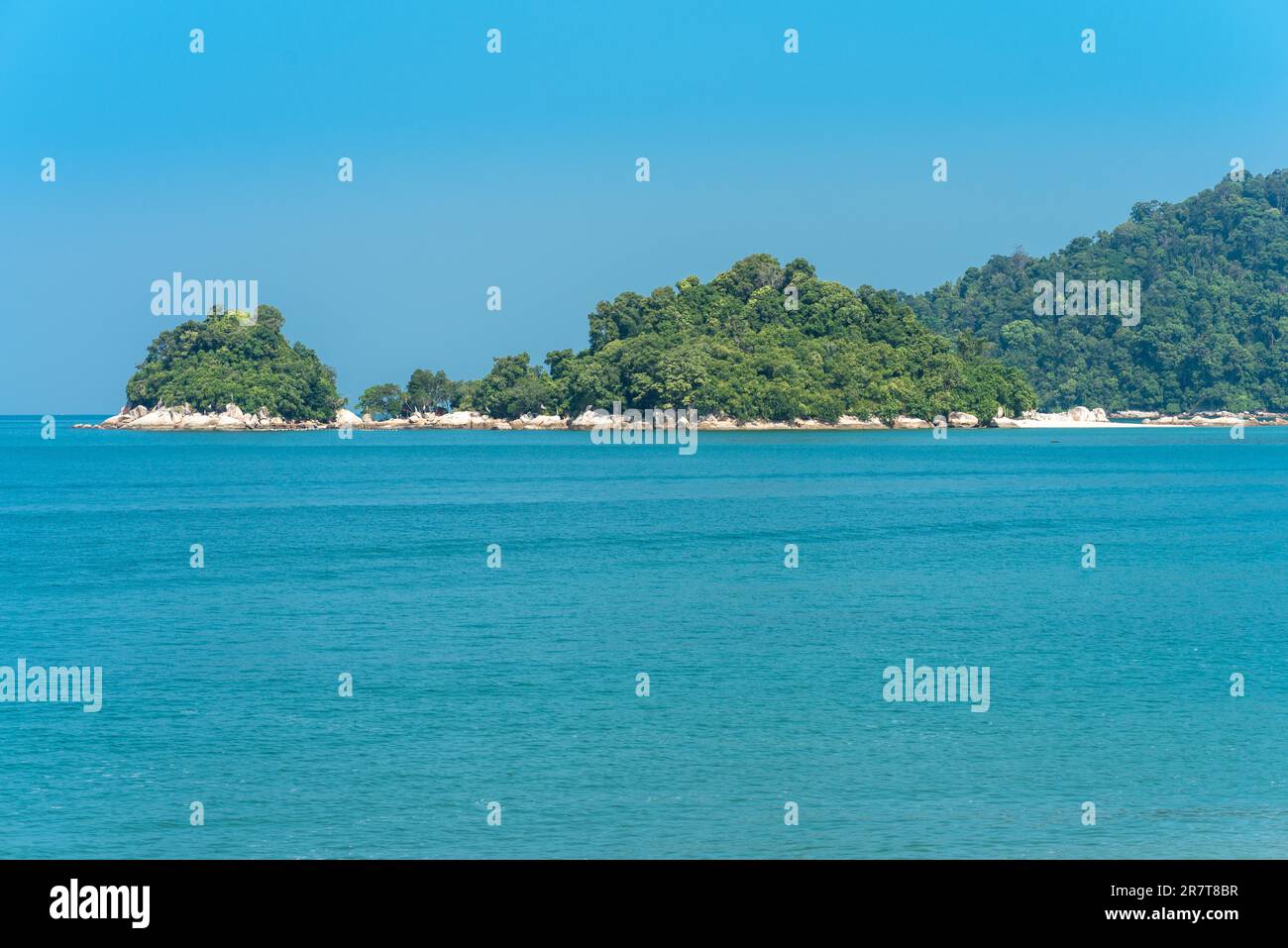 View to the island of Giam. A small rocky isle with a little beach ...
