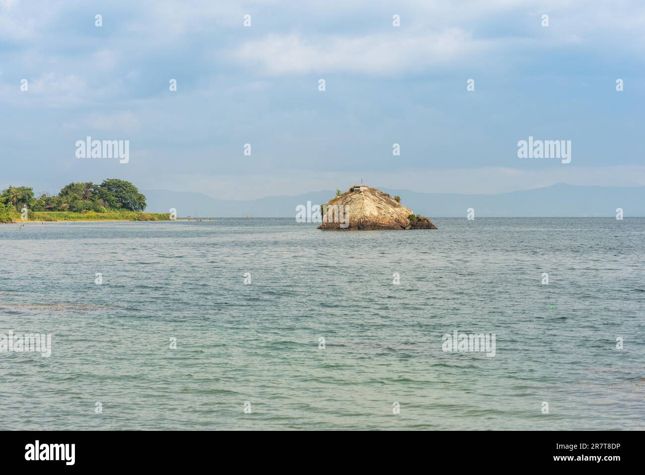 Legend has it that the large stone, the Batu Guru, which is carried by ...