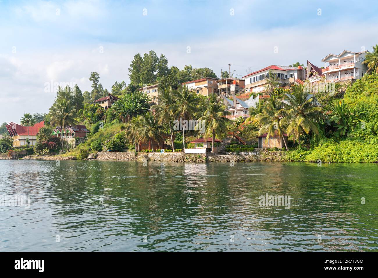 The island Samosir and peninsula Tuktuk Siadong with its resorts ...