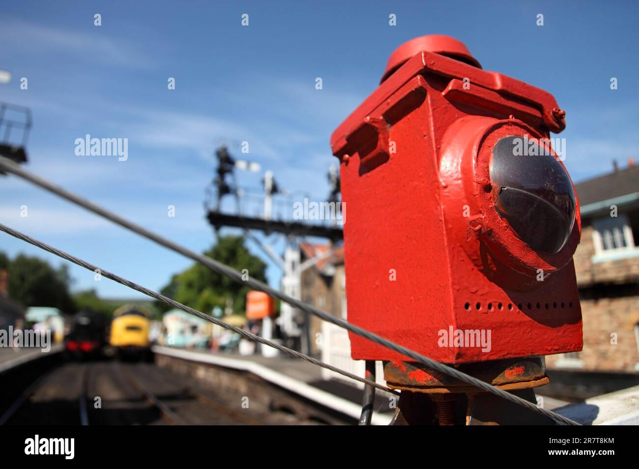 Warning light on level crossing gates at Grosmont station, North ...