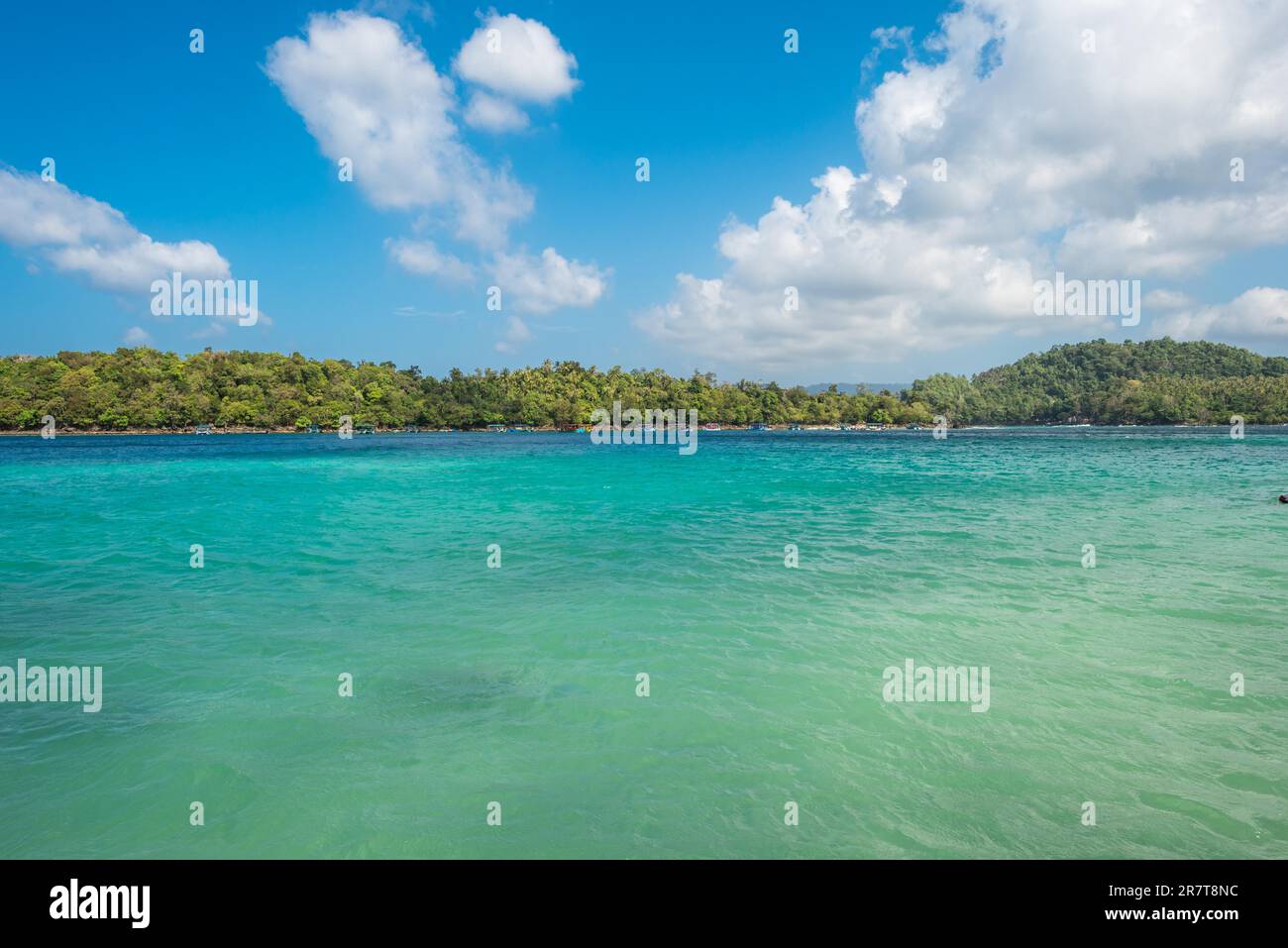 The islet Rubiah with its diving resorts faced of the village and ...