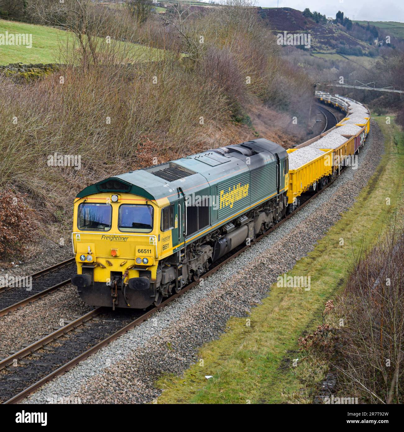 A Freightliner Class 66 rolls towards Marsden, carrying an engineering ...
