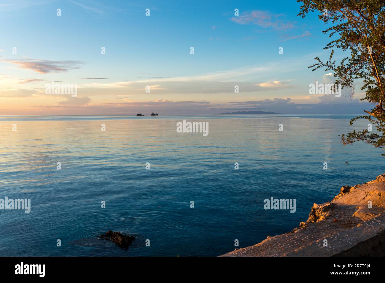View to the sea at sunset on the Togian archipelago on Sulawesi. The ...