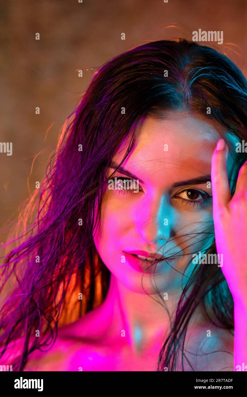 Portrait shot of a pretty young woman in RGB colors Stock Photo - Alamy