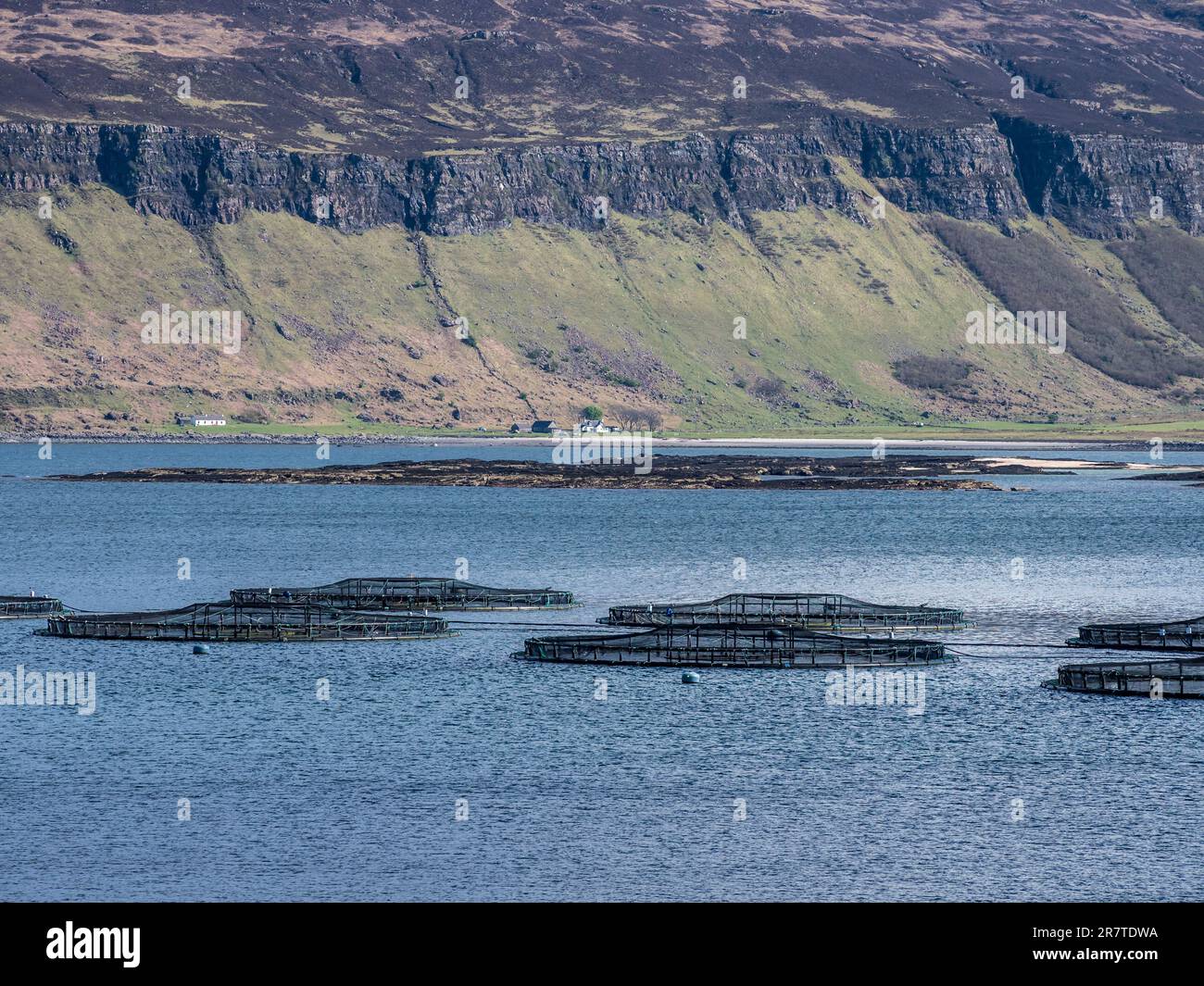 Floating cages of a salmon farm, sea between Isle of Ulva and Isle of ...