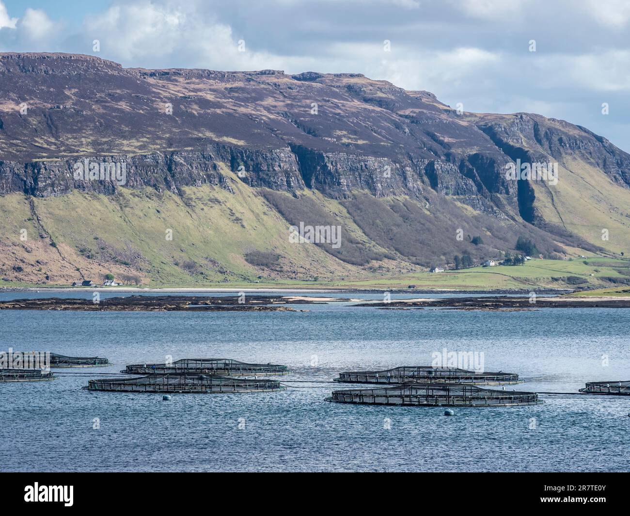 Floating cages of a salmon farm, sea between Isle of Ulva and Isle of ...