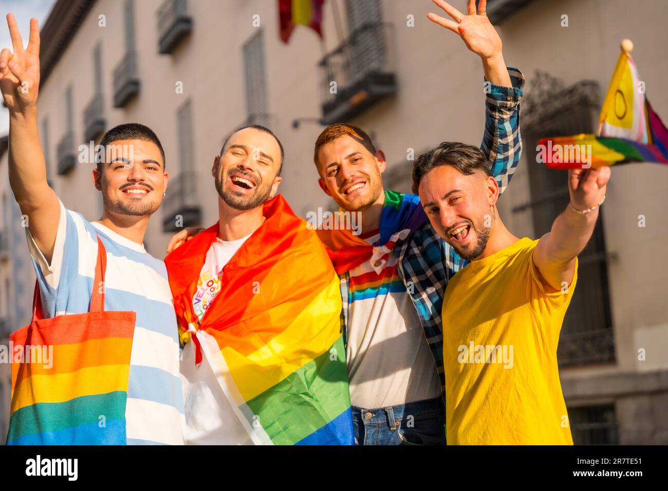 Gay pride party in the city, portrait of couples of men having fun at ...