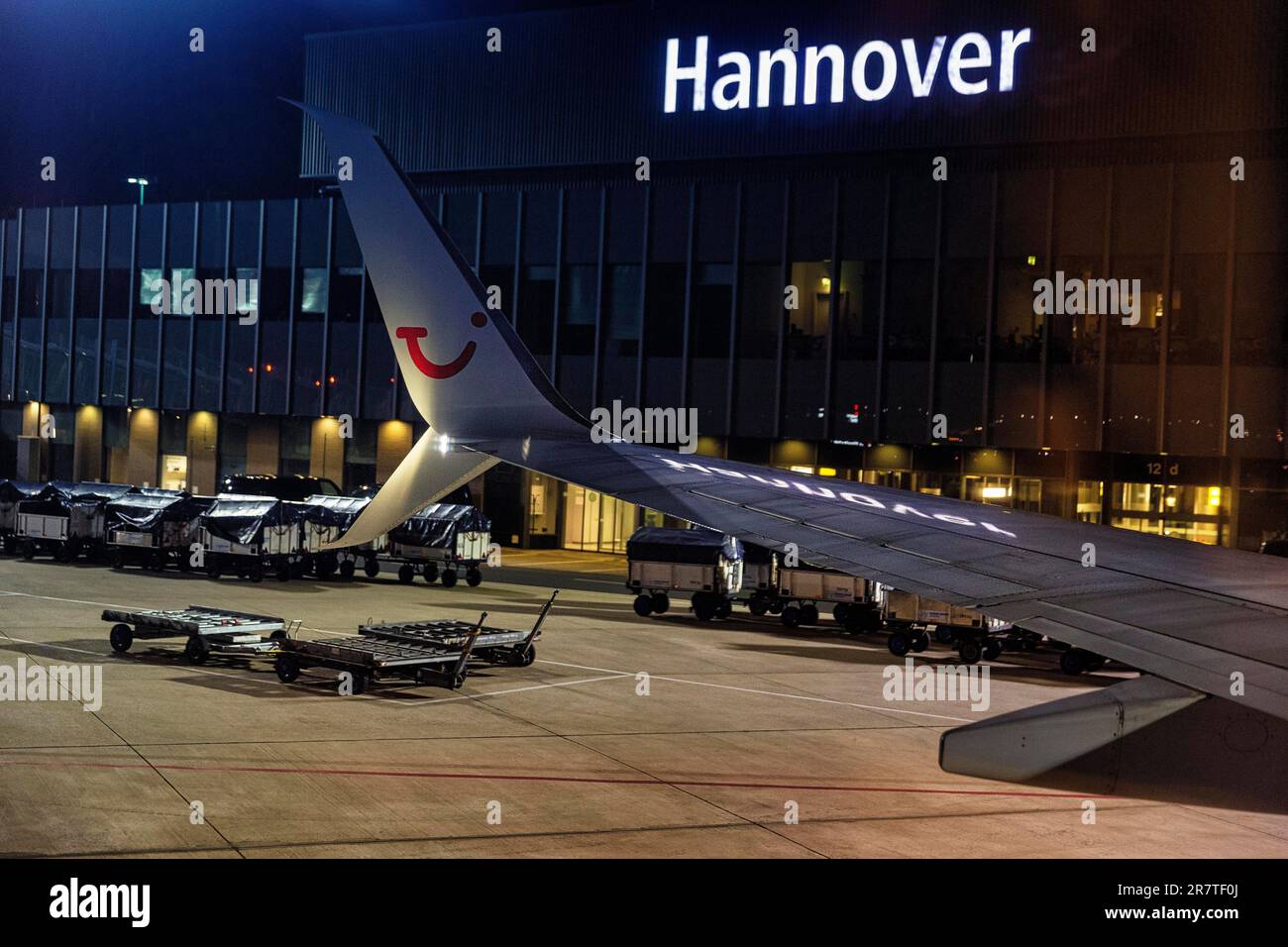 Passenger aircraft at the airport, Hanover lettering, wing with TUI AG ...
