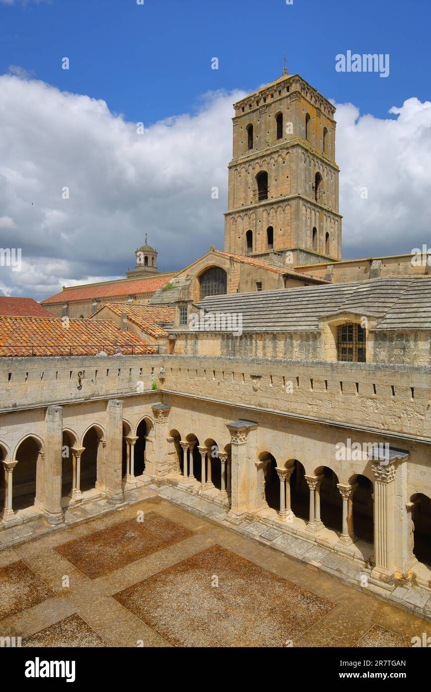 View of church tower and courtyard with cloister, Romanesque Cloitre St ...
