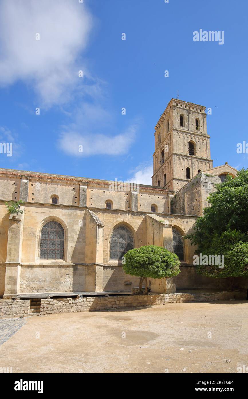 Inner courtyard with church tower of the Romanesque monastery Cloitre ...