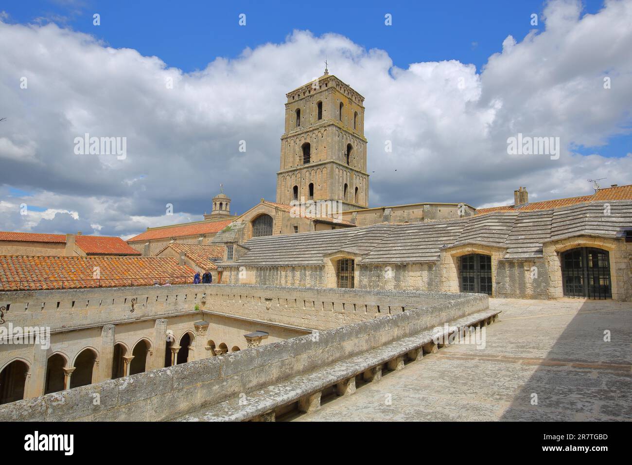View of church tower and courtyard with cloister, Romanesque Cloitre St ...