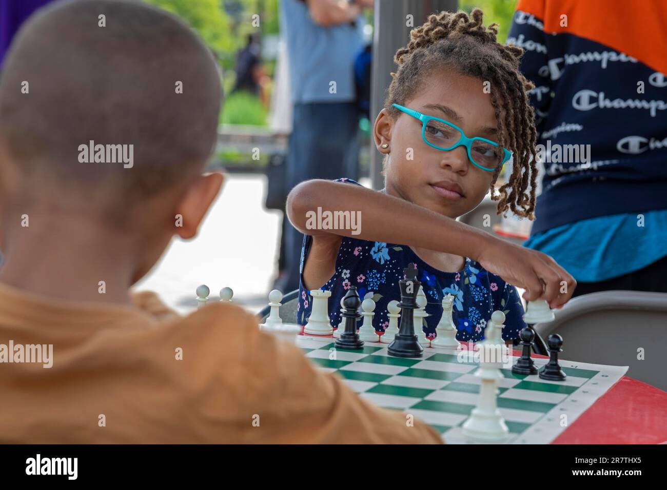 Washington, DC, Children play chess at the Eastern Market Metro Plaza ...