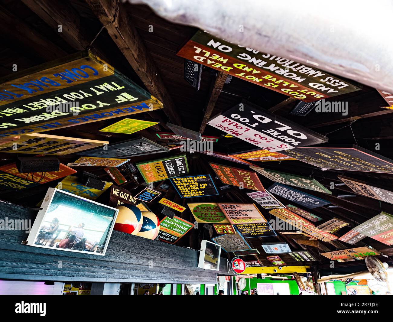 A room with a variety of signs and motivative quotes attached to the ...