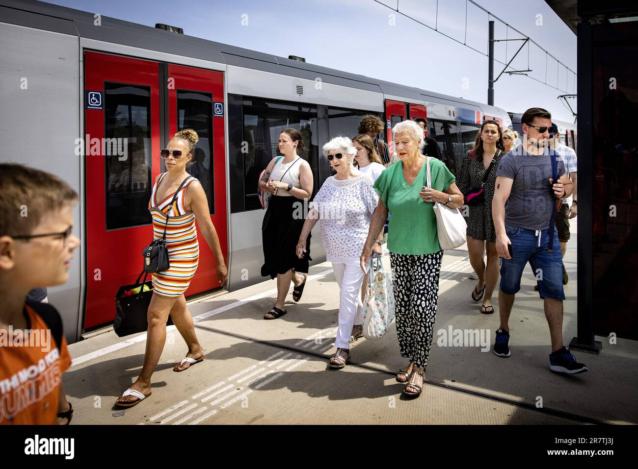 HOEK VAN HOLLAND - Travelers arrive by metro on the beach of Hoek van ...