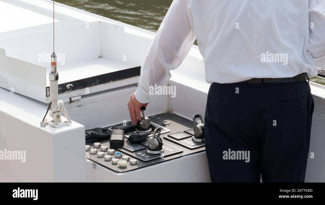 Boat Operator Controlling Navigation Equipment at Deck Console Stock ...