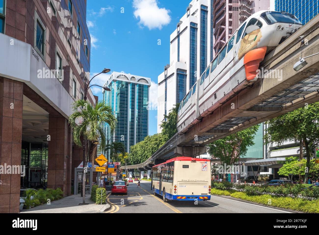 Streetscape of traffic, bridge and train in the Bukit Bintang district ...